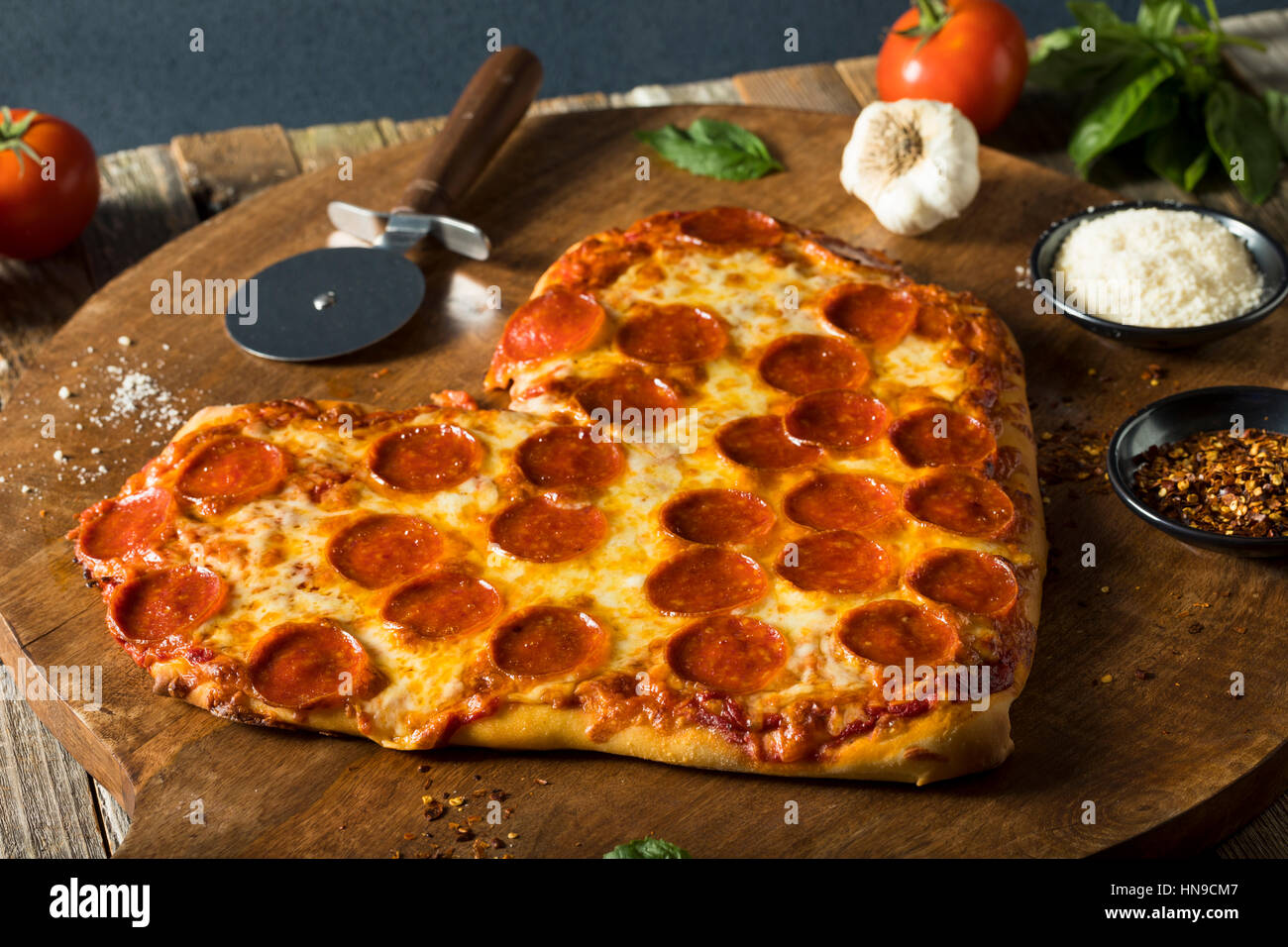 Homemade Heart Shaped Pepperoni Pizza Ready to Eat Stock Photo - Alamy