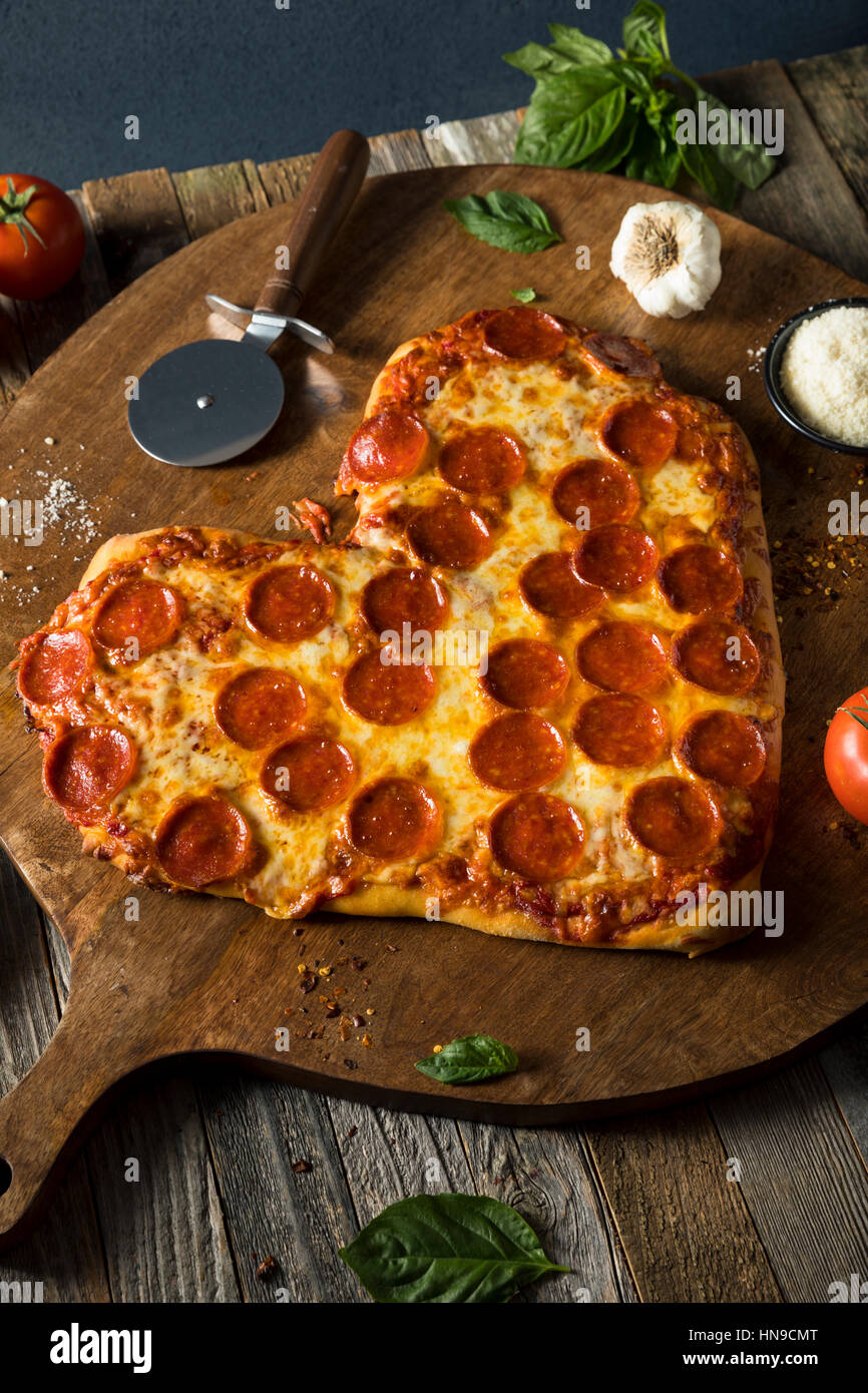 Homemade Heart Shaped Pepperoni Pizza Ready to Eat Stock Photo - Alamy