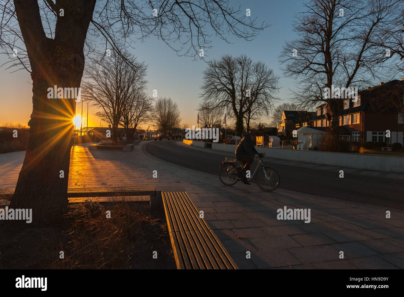 Promenade and street along the habor of Strande community near Kiel ...