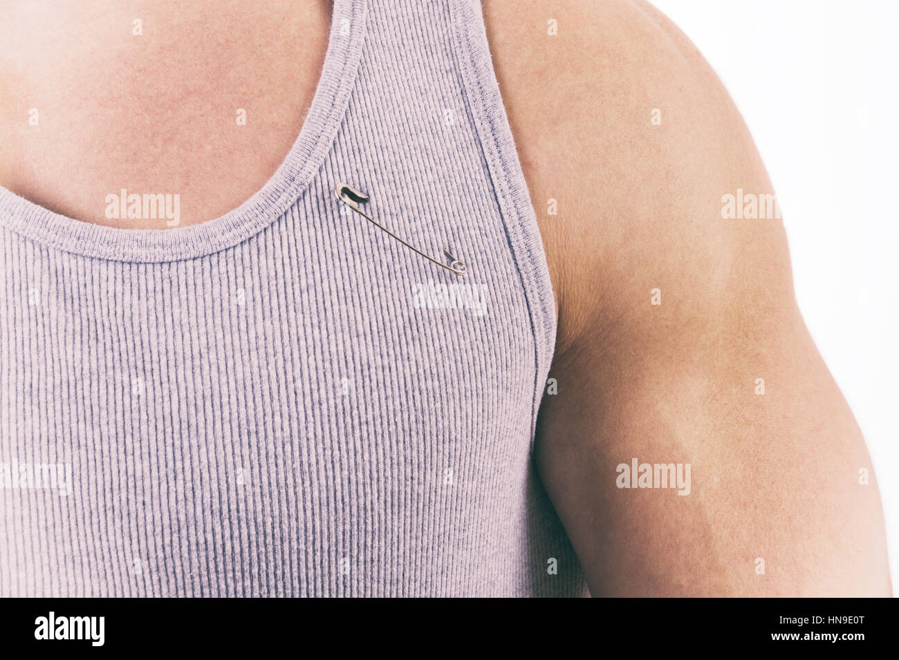Man wearing a safety pin as a symbol of solidarity Stock Photo - Alamy