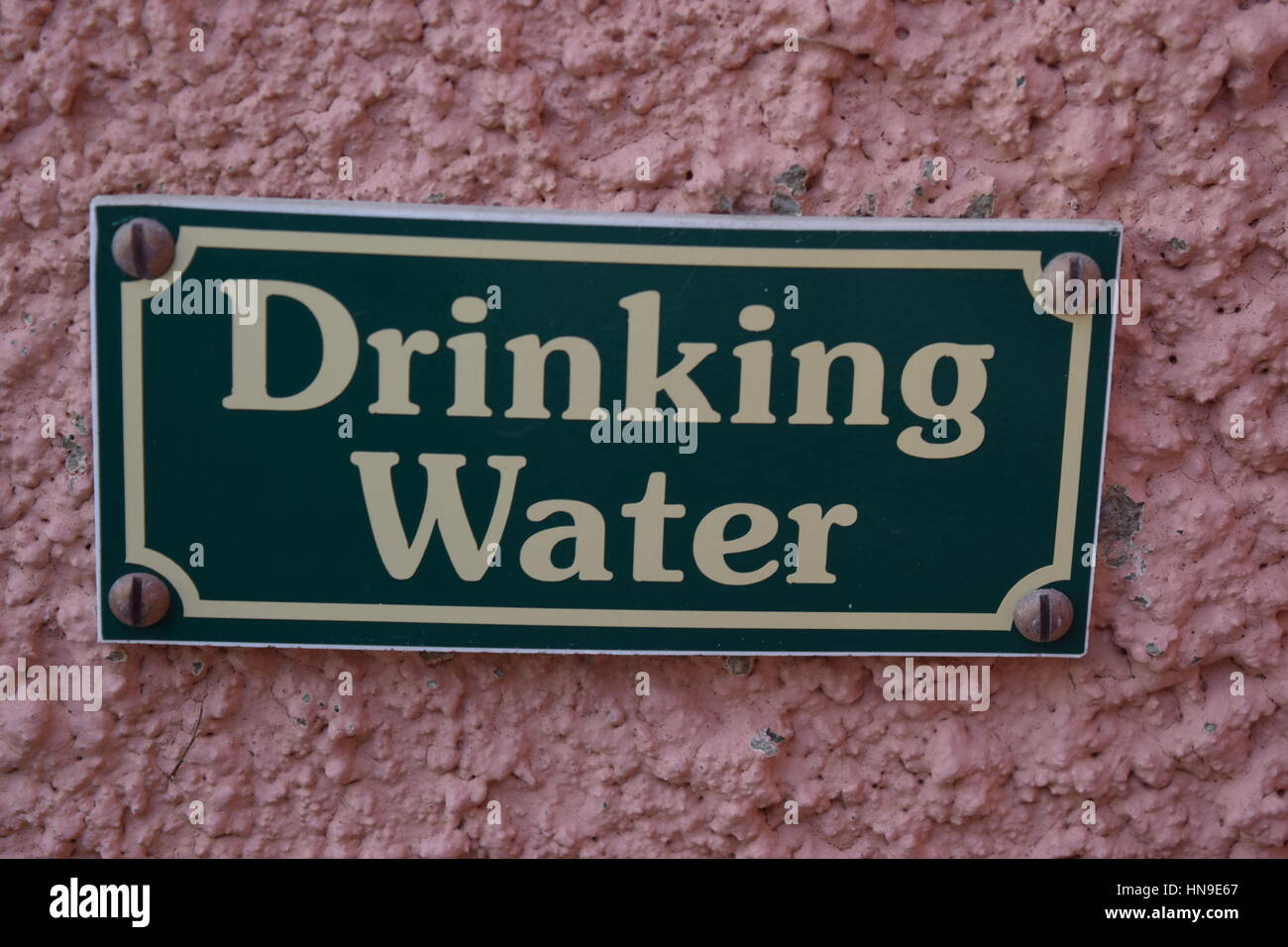 Drinking water sign on a wall Stock Photo - Alamy