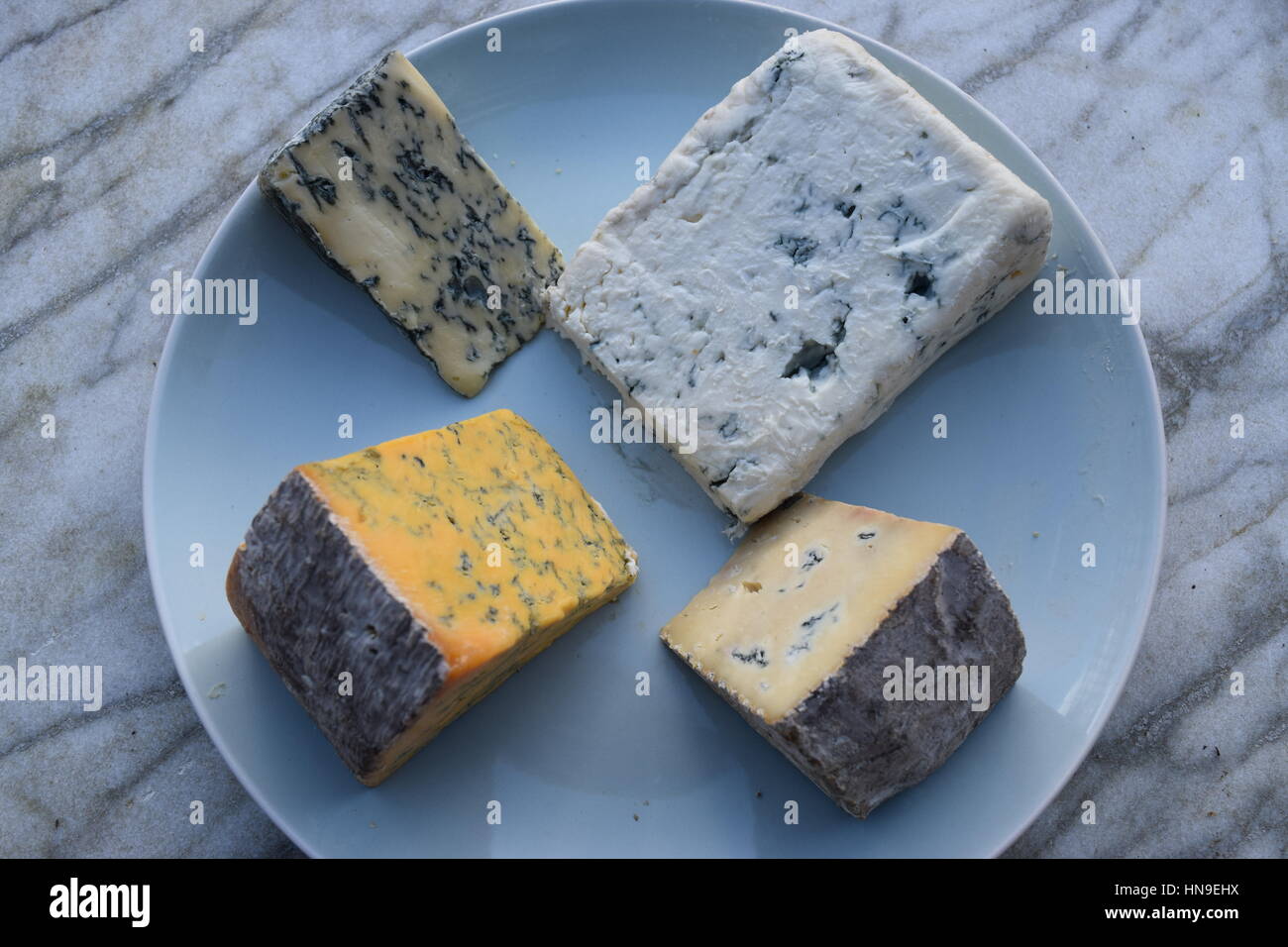 Different types of cheese on a plate Stock Photo - Alamy
