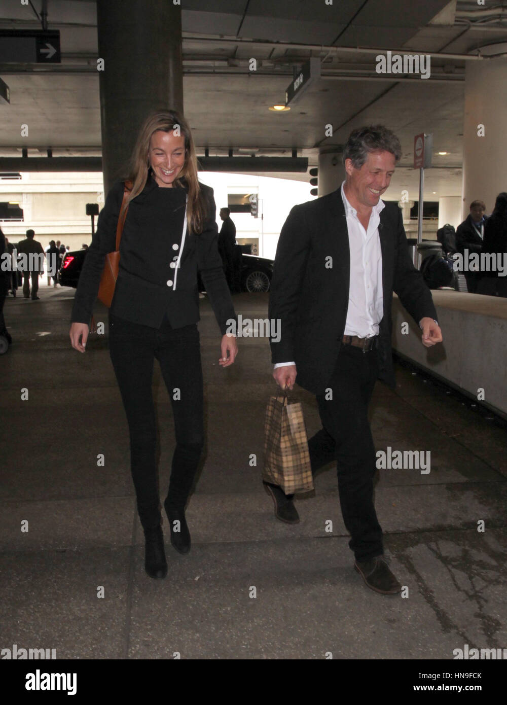 Hugh Grant arrives with partner Anna Elisabet Eberstein at Los Angeles ...