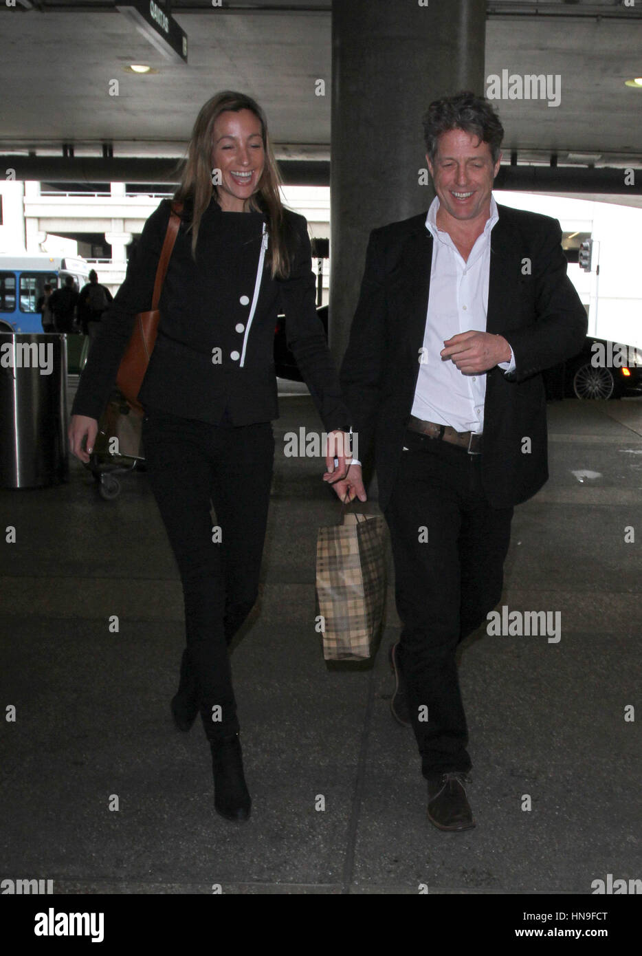 Hugh Grant arrives with partner Anna Elisabet Eberstein at Los Angeles ...