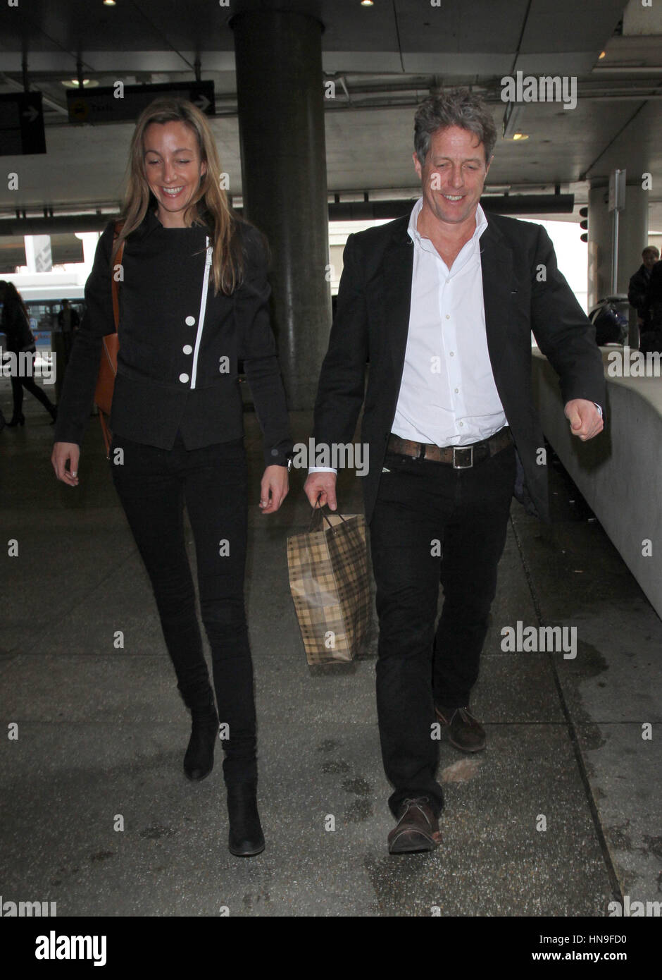 Hugh Grant arrives with partner Anna Elisabet Eberstein at Los Angeles ...