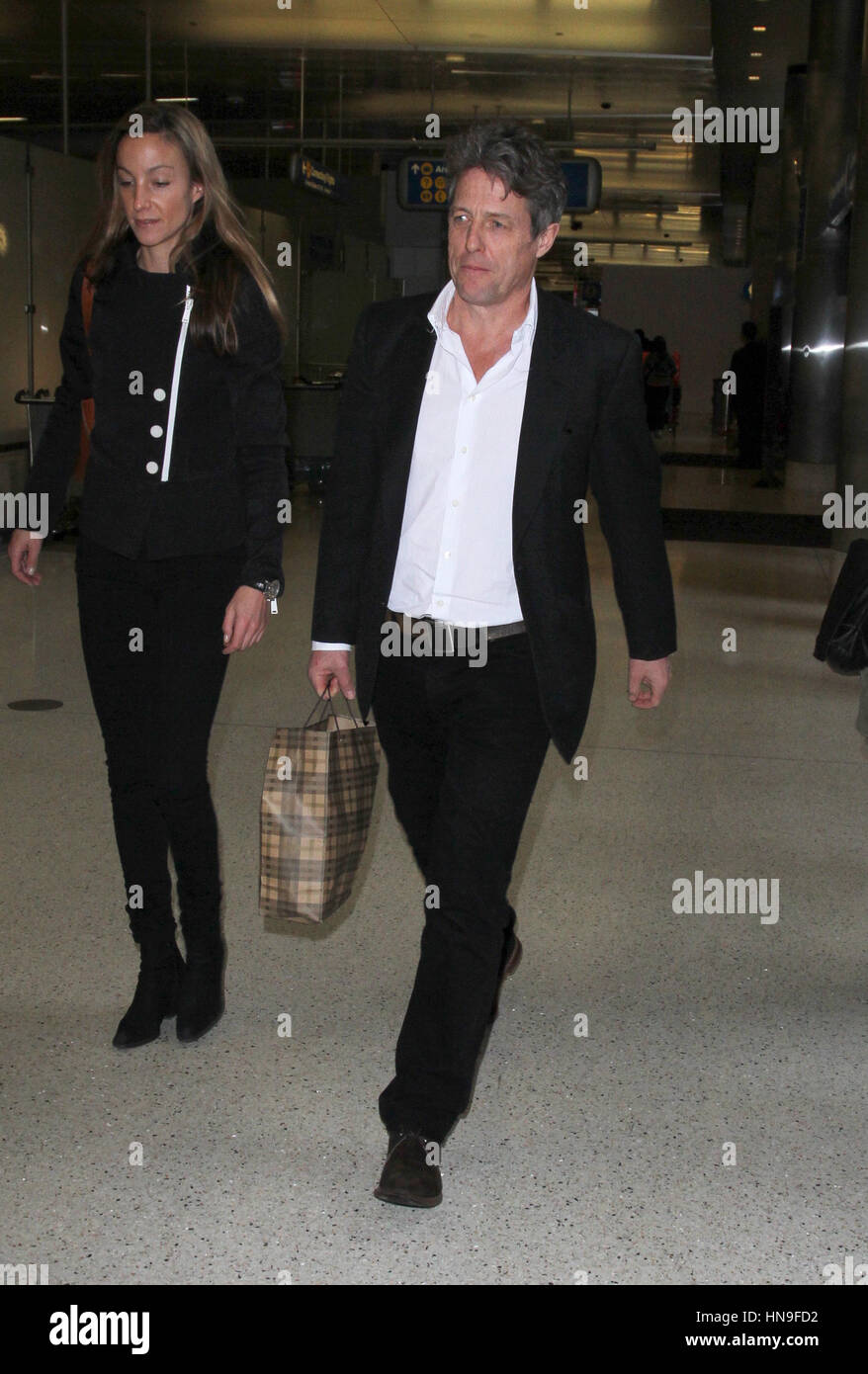 Hugh Grant arrives with partner Anna Elisabet Eberstein at Los Angeles ...
