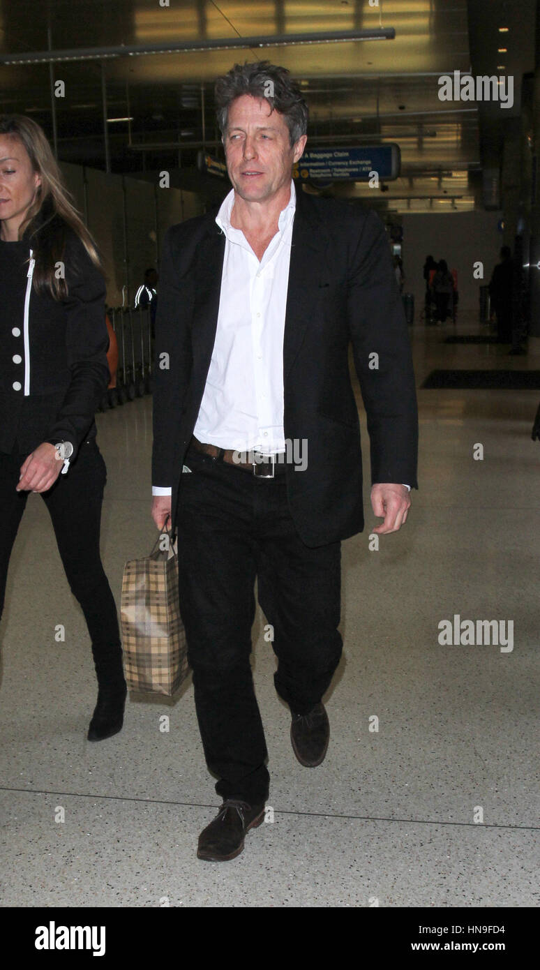 Hugh Grant arrives with partner Anna Elisabet Eberstein at Los Angeles ...