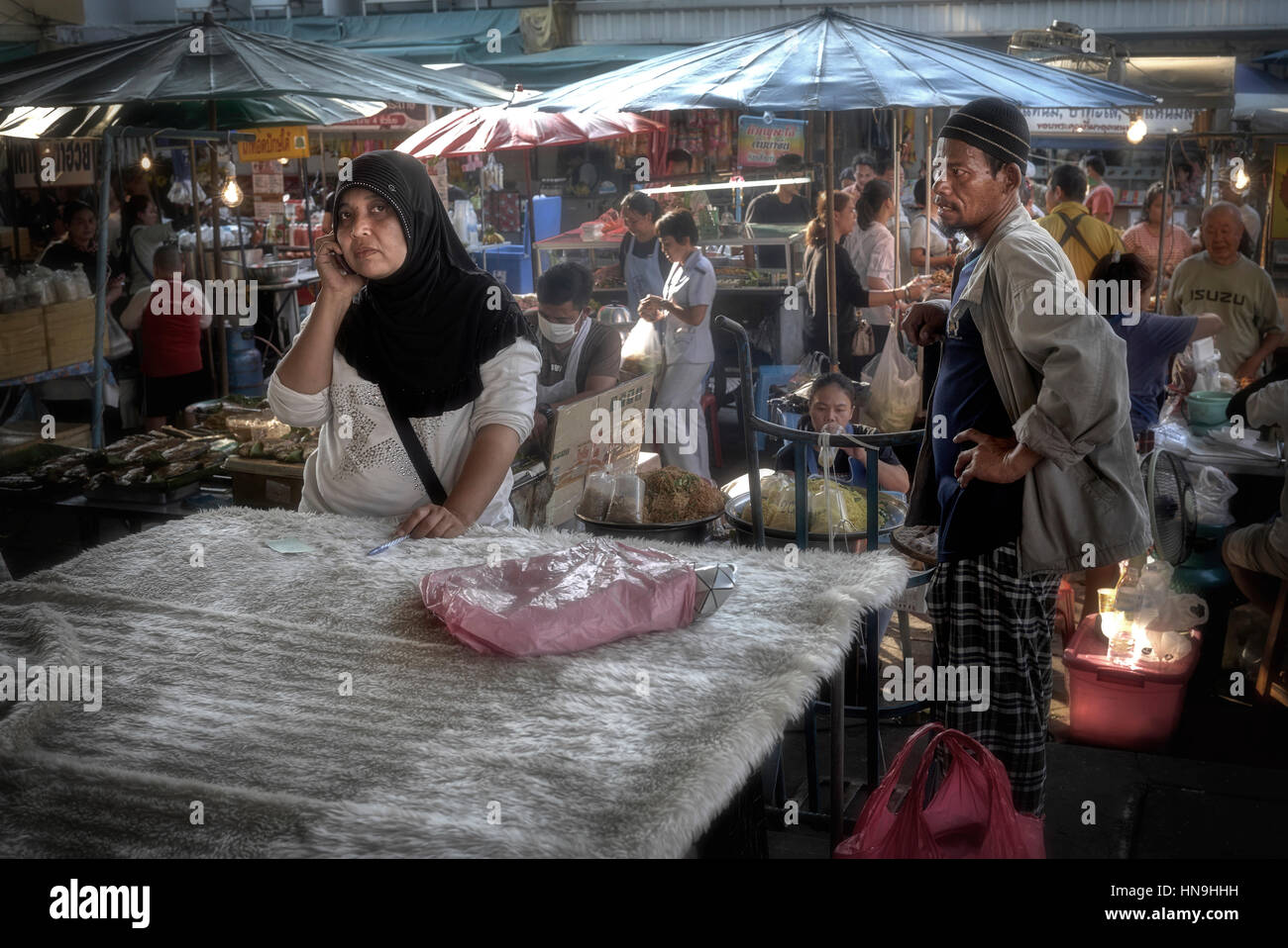 Muslim market vendor couple at a Thailand street market. Southeast Asia ...