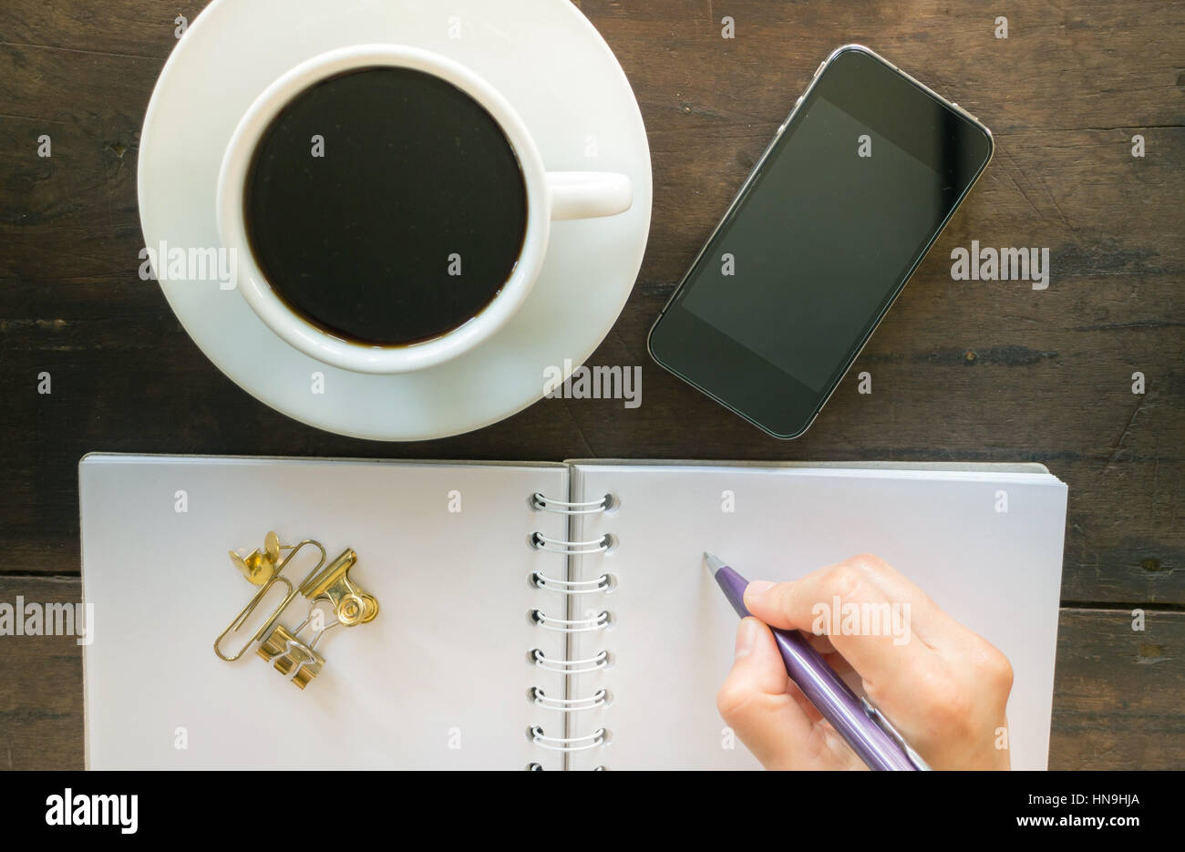 Hot cup of coffee on wooden work table, stock photo Stock Photo - Alamy