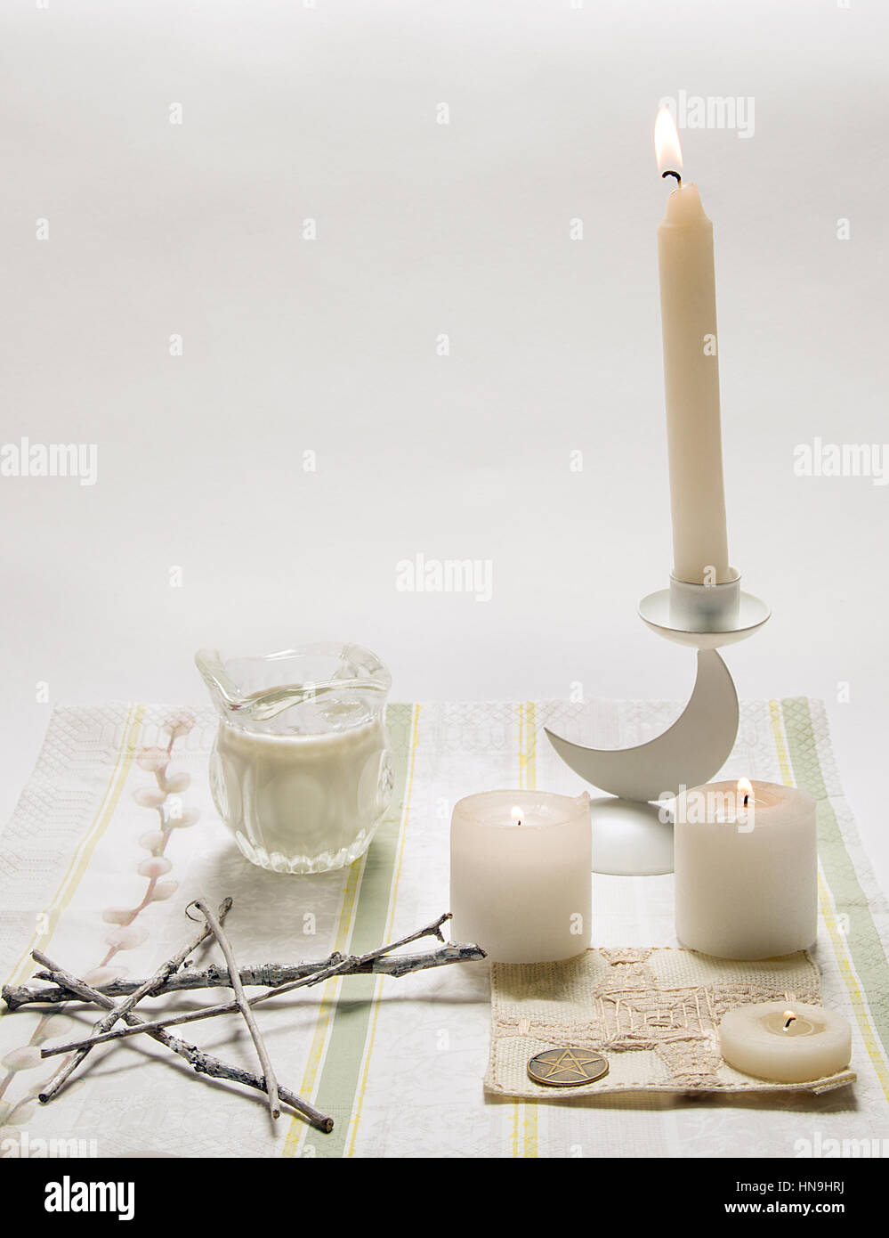 White wiccan altar with candles Stock Photo - Alamy