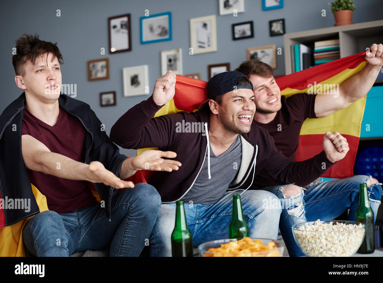 Two against one in the living room Stock Photo - Alamy