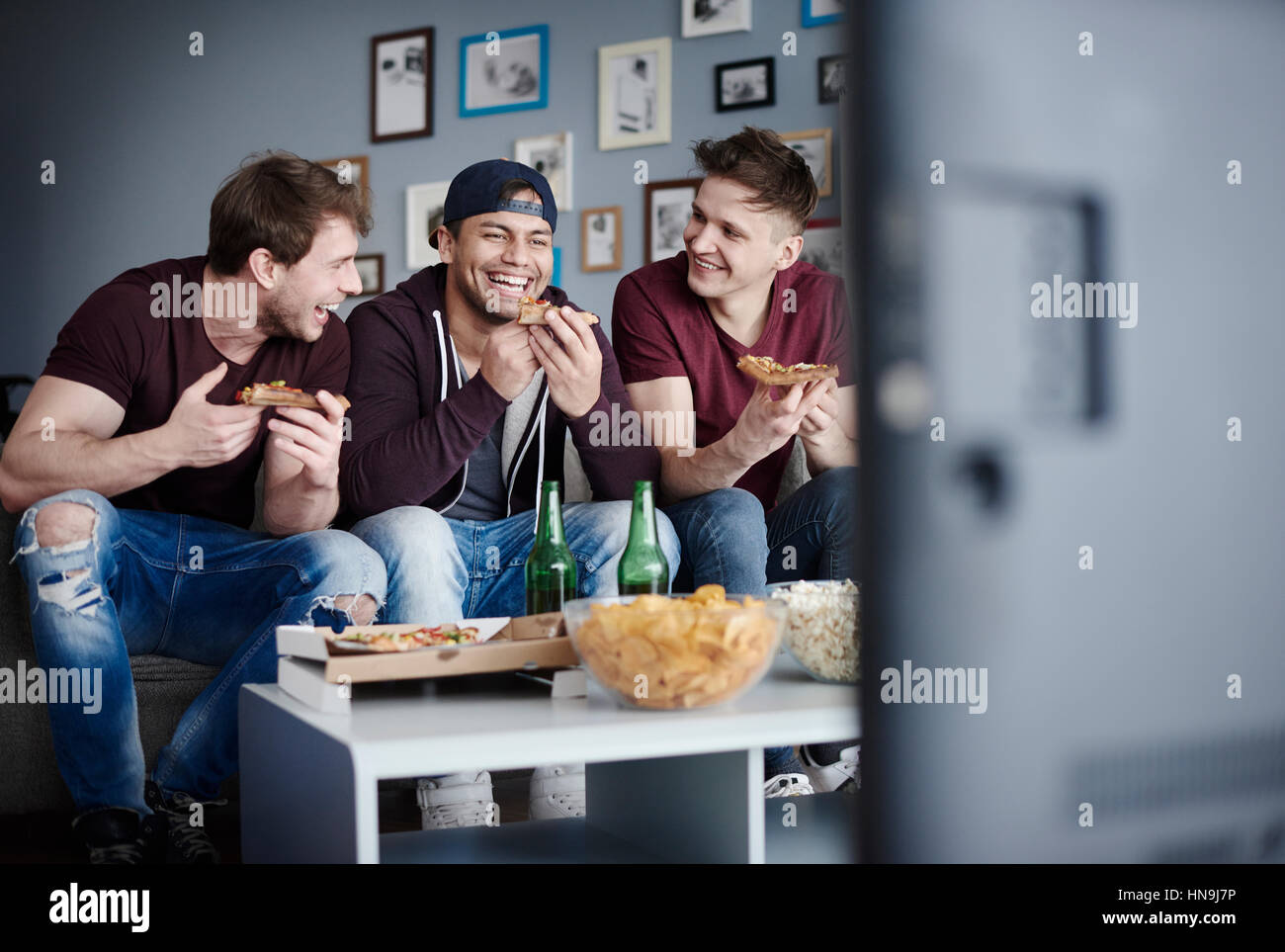 Friendship having snack watching match hi-res stock photography and ...