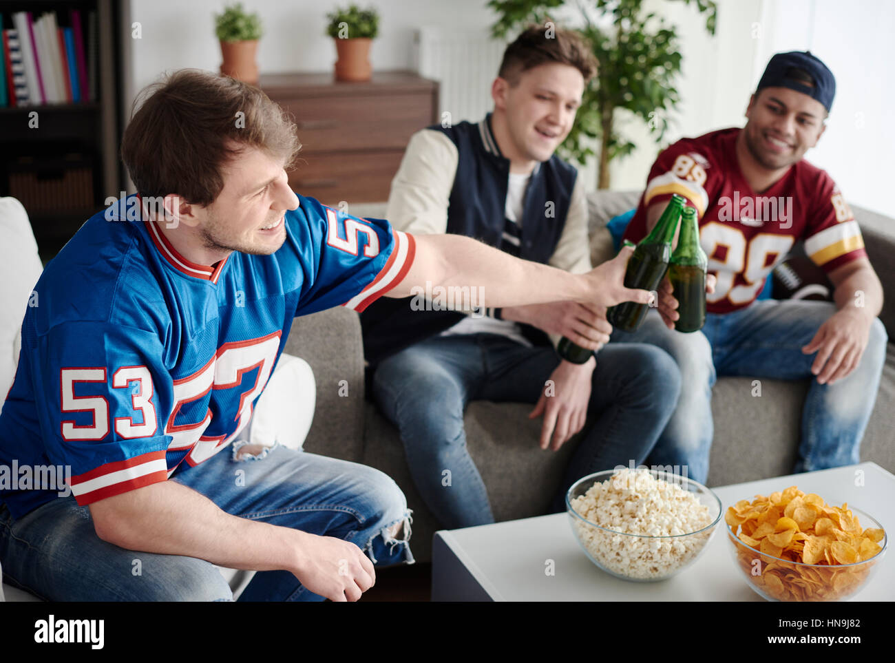 Cheerful guys hi-res stock photography and images - Alamy