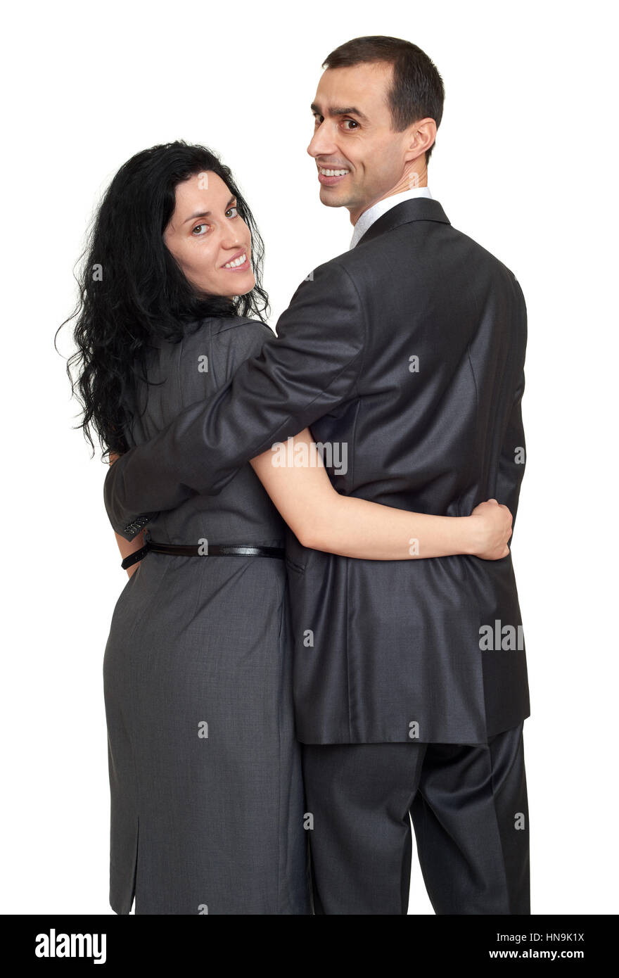 couple rear view, people backside look around, dressed in classic suit ...