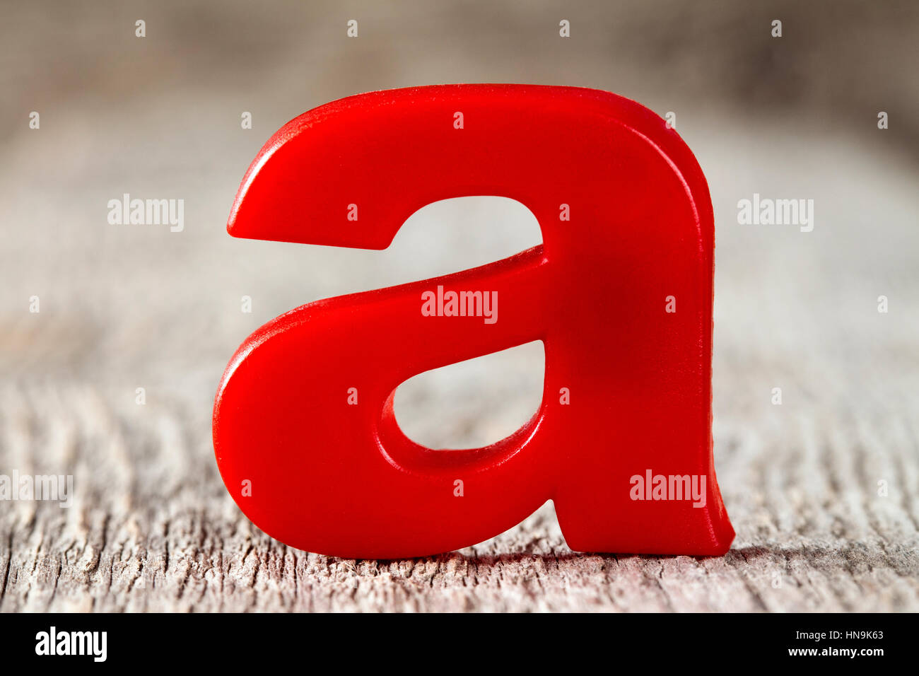 First letter of alphabet on the wooden background Stock Photo - Alamy