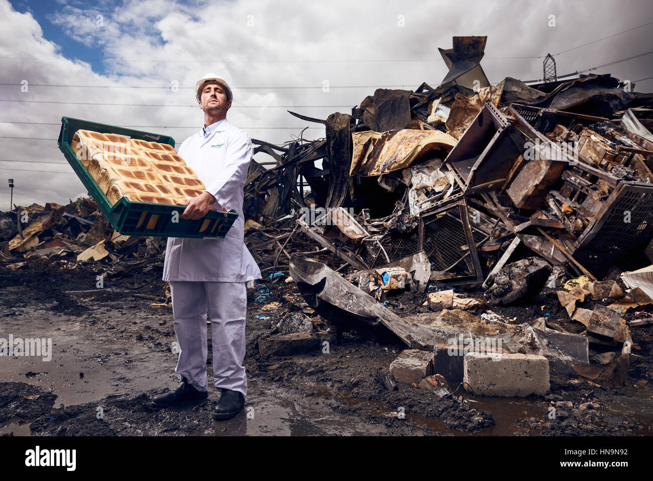 A team of Morrisons bakers are pictured in the ruins of their bakery in ...