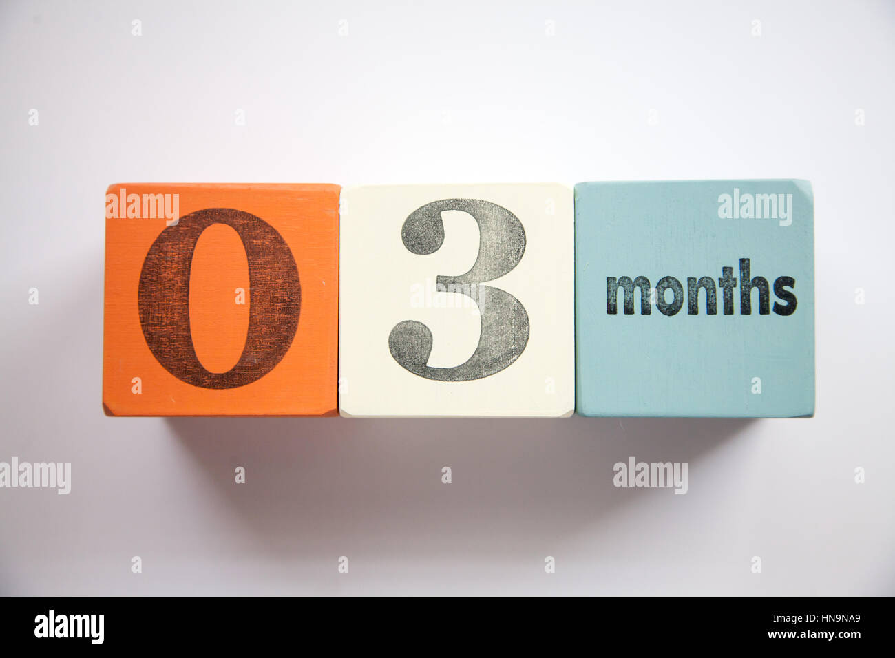 Baby blocks three months age Stock Photo - Alamy