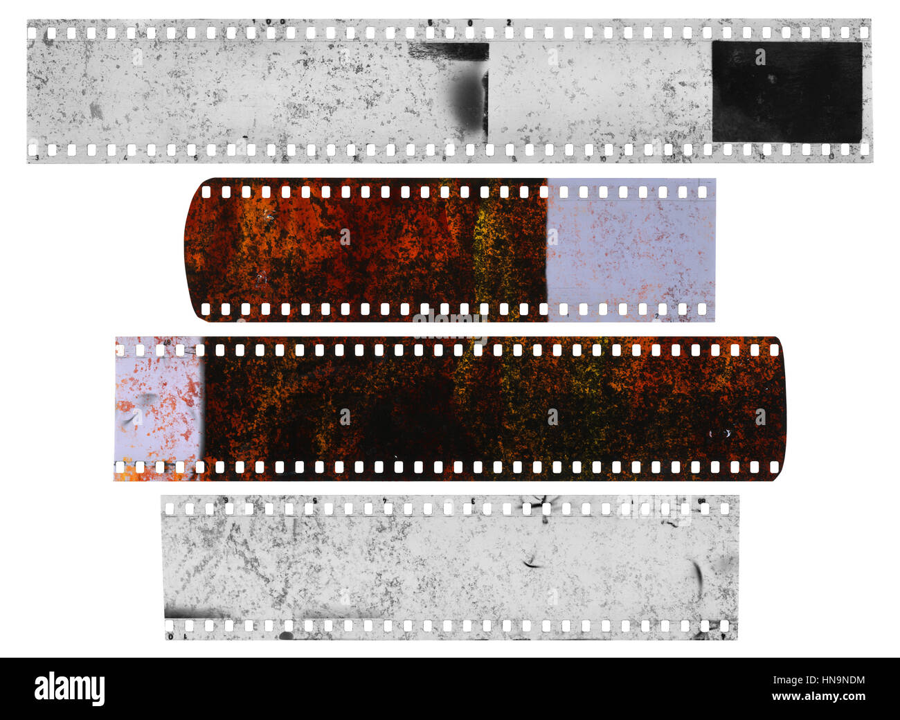 Dirty, messy and damaged strips of celluloid film on white background ...