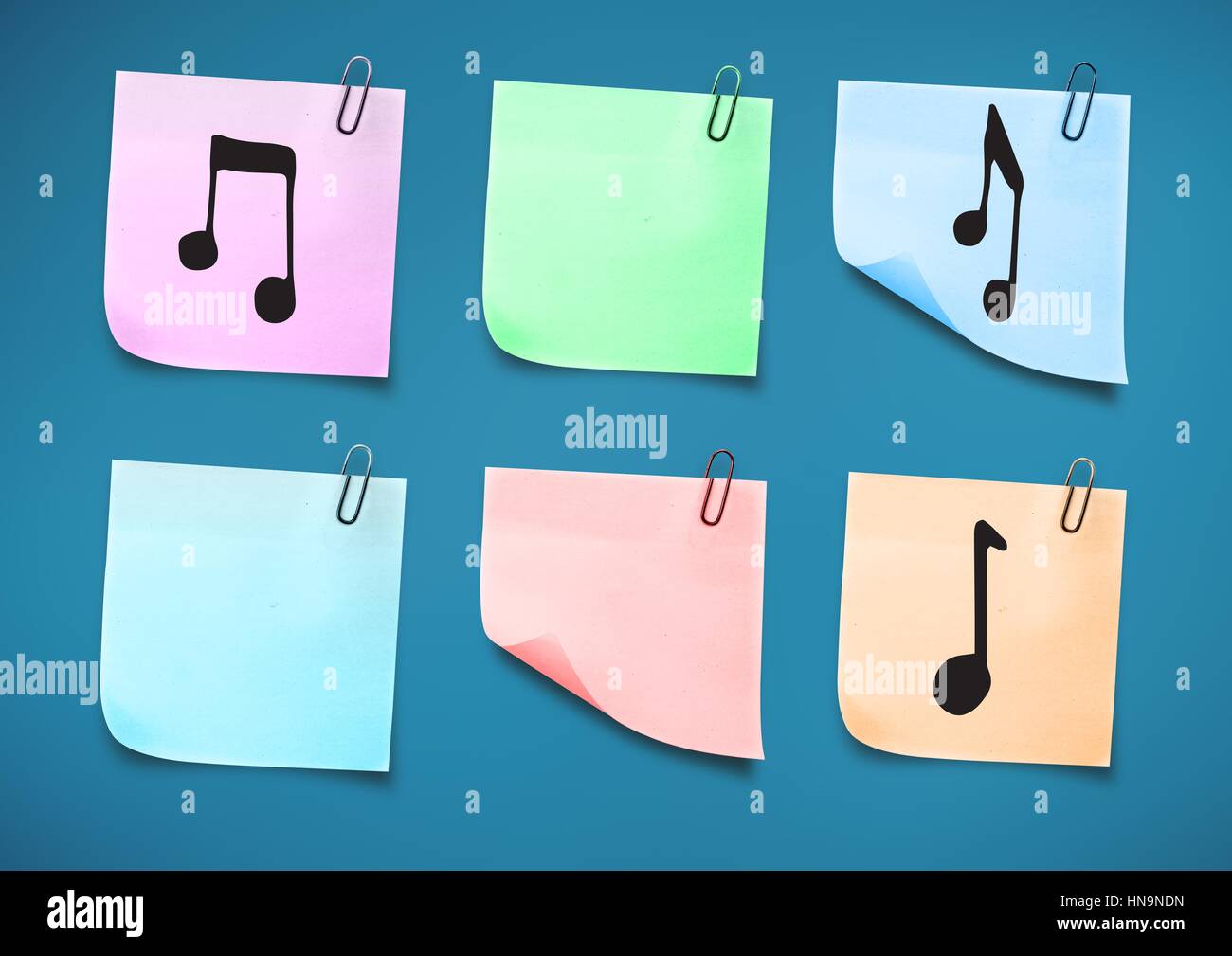 Digital composite of Sticky Note with Music Icons against a neutral ...