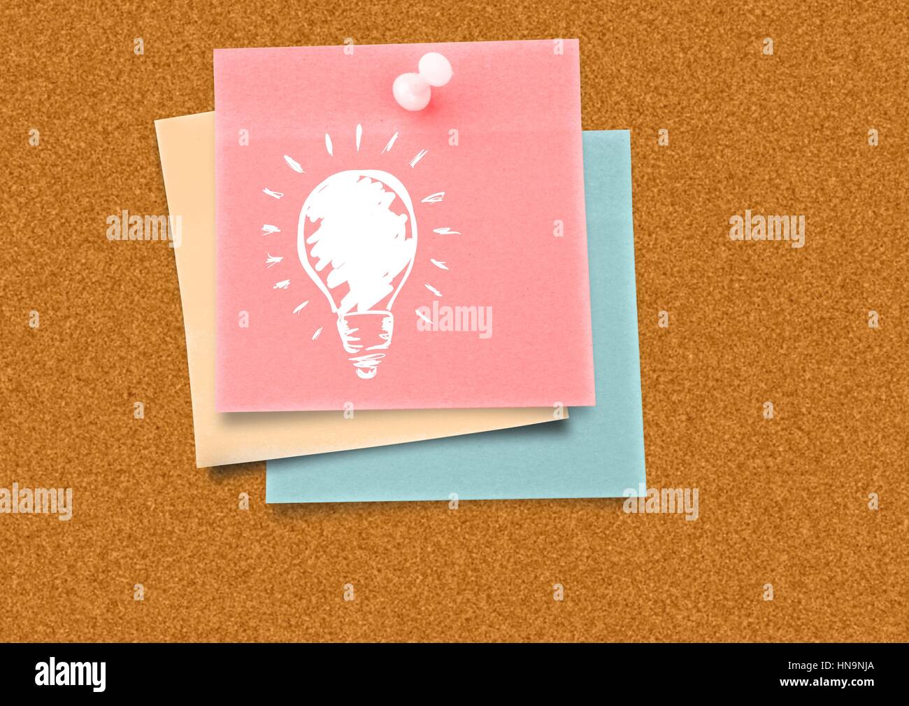 Digital composite of Sticky Note with Light bulb Idea against a board ...