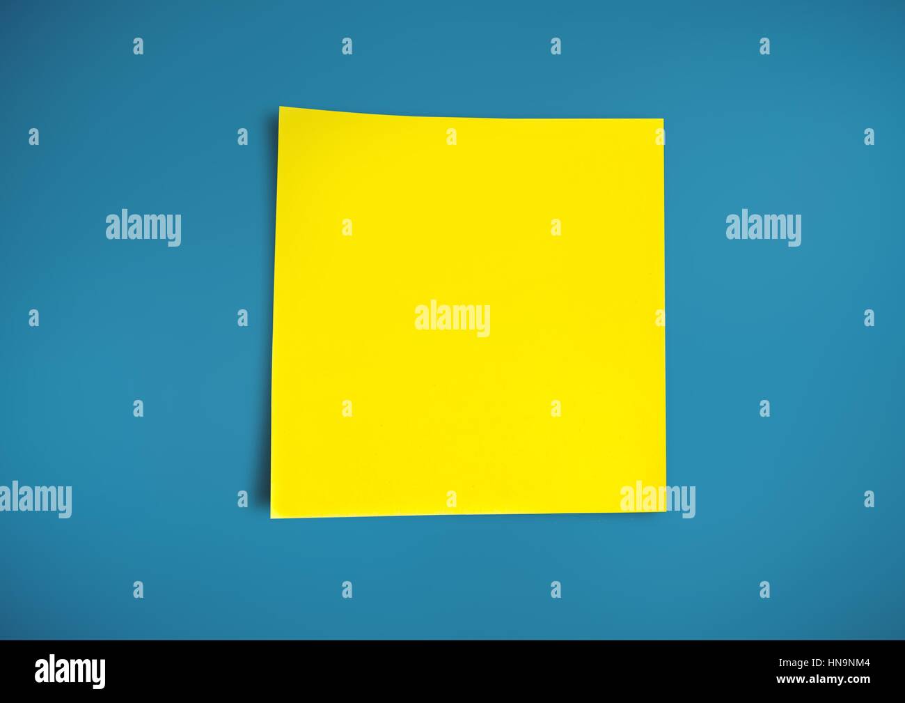 Digital composite of yellow Sticky Note against blue background Stock ...