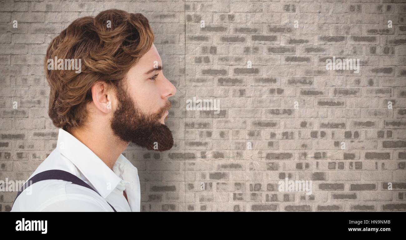 Digital composite of Man with beard against brick wall Stock Photo - Alamy