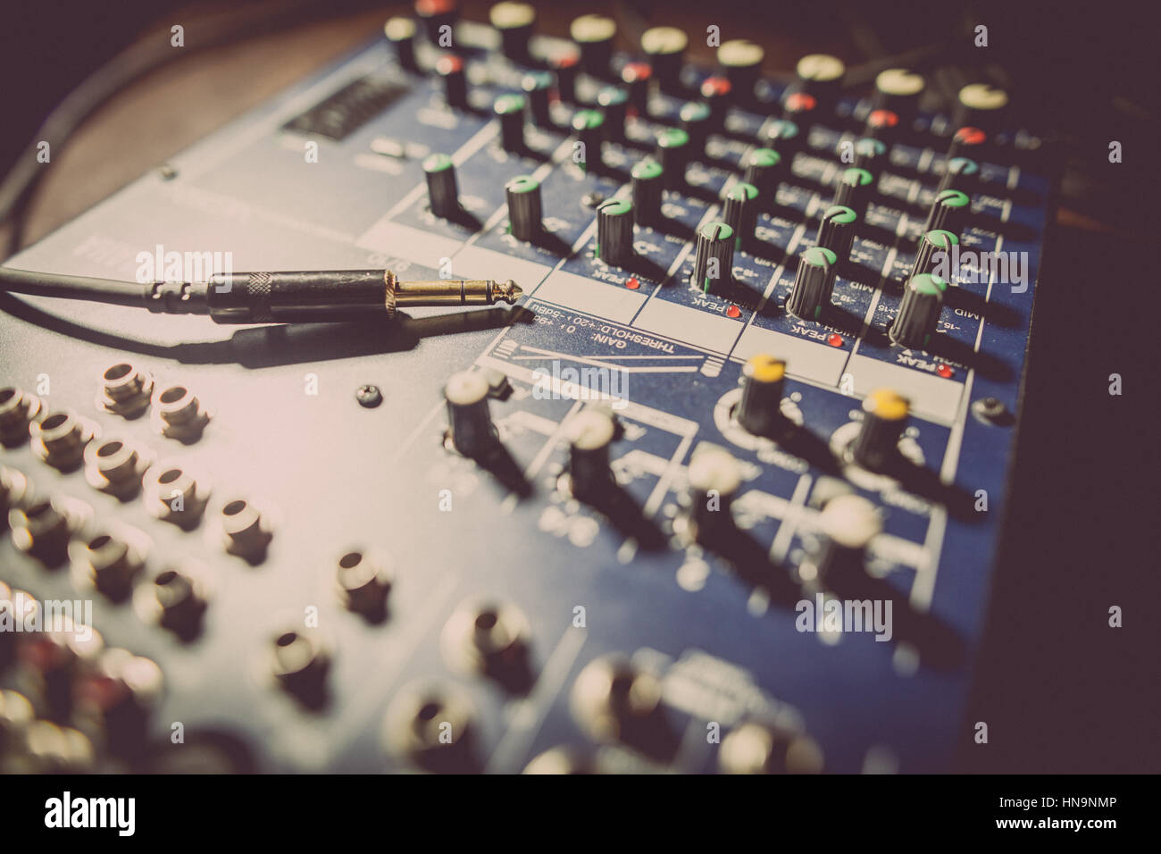 Close up shot of a mixer desk with many buttons and cables Stock Photo ...
