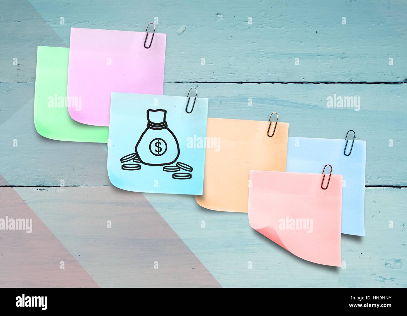 Digital composite of Sticky Note with Money Icon against wood panel ...