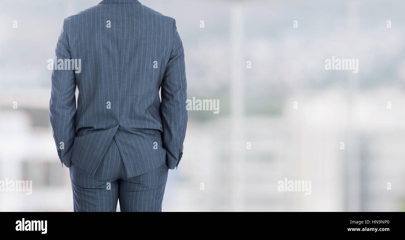 Digital composite of Businessman back against windows Stock Photo - Alamy