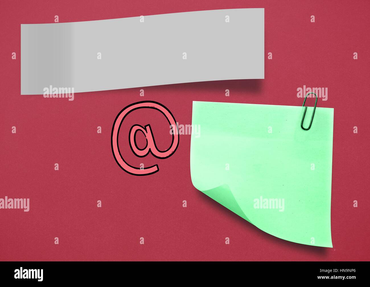 Digital composite of Sticky Note and Email Icon against red background ...