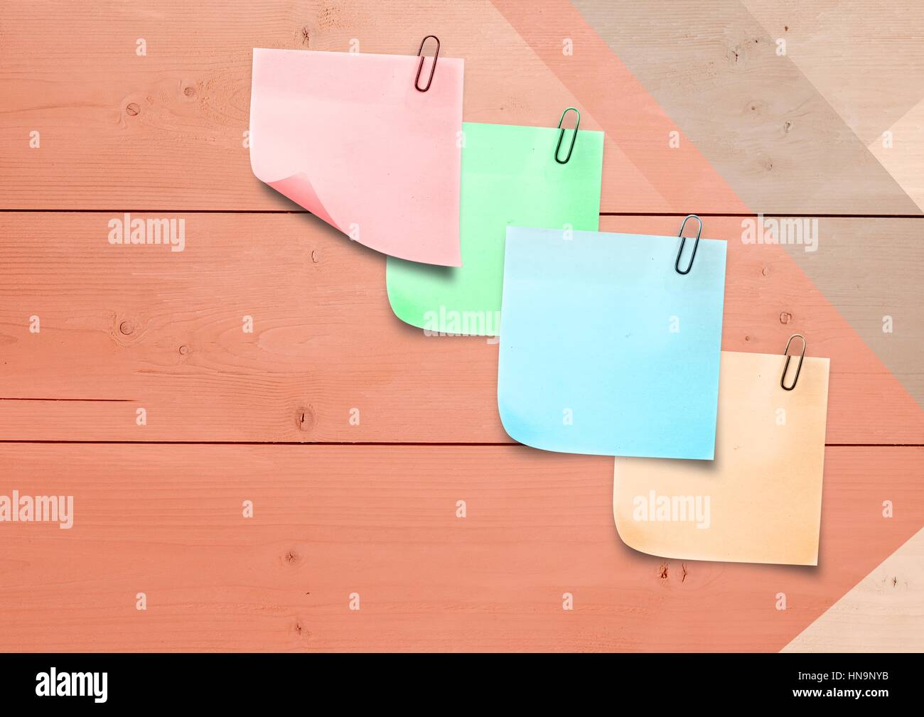 Digital composite of Sticky Note against wood wall Stock Photo - Alamy