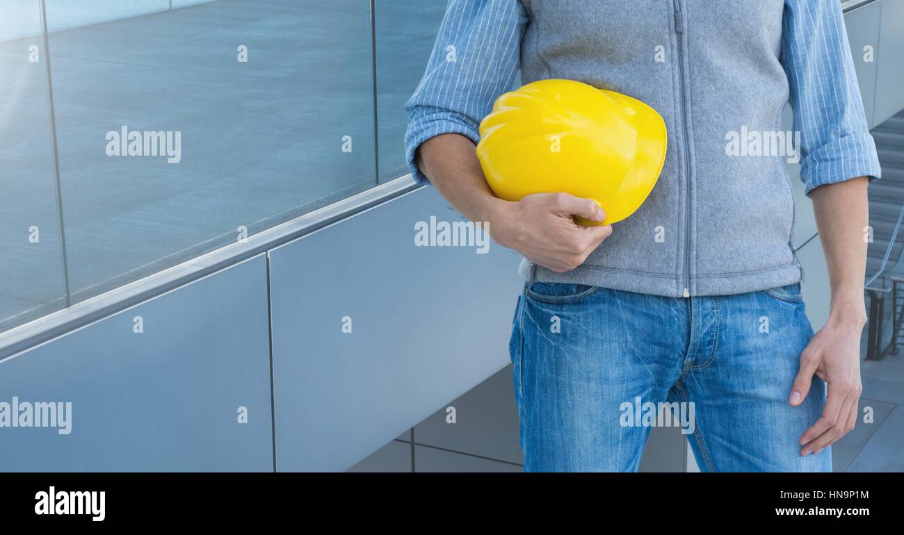 Digital composite of Architect Torso holding a cask against windows ...