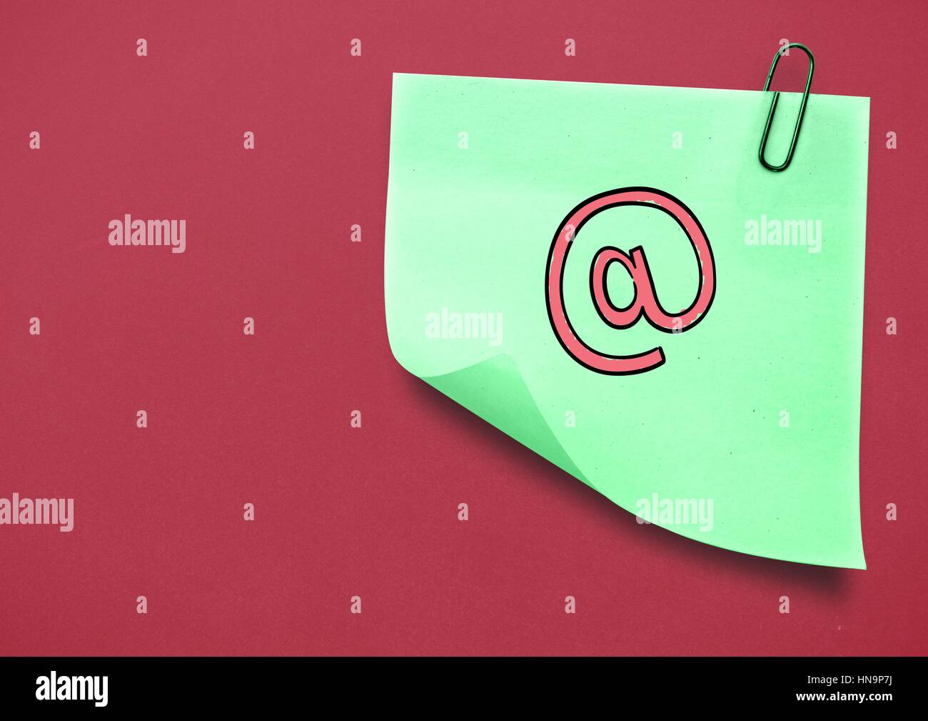Digital composite of Sticky Note with Email icon against red background ...