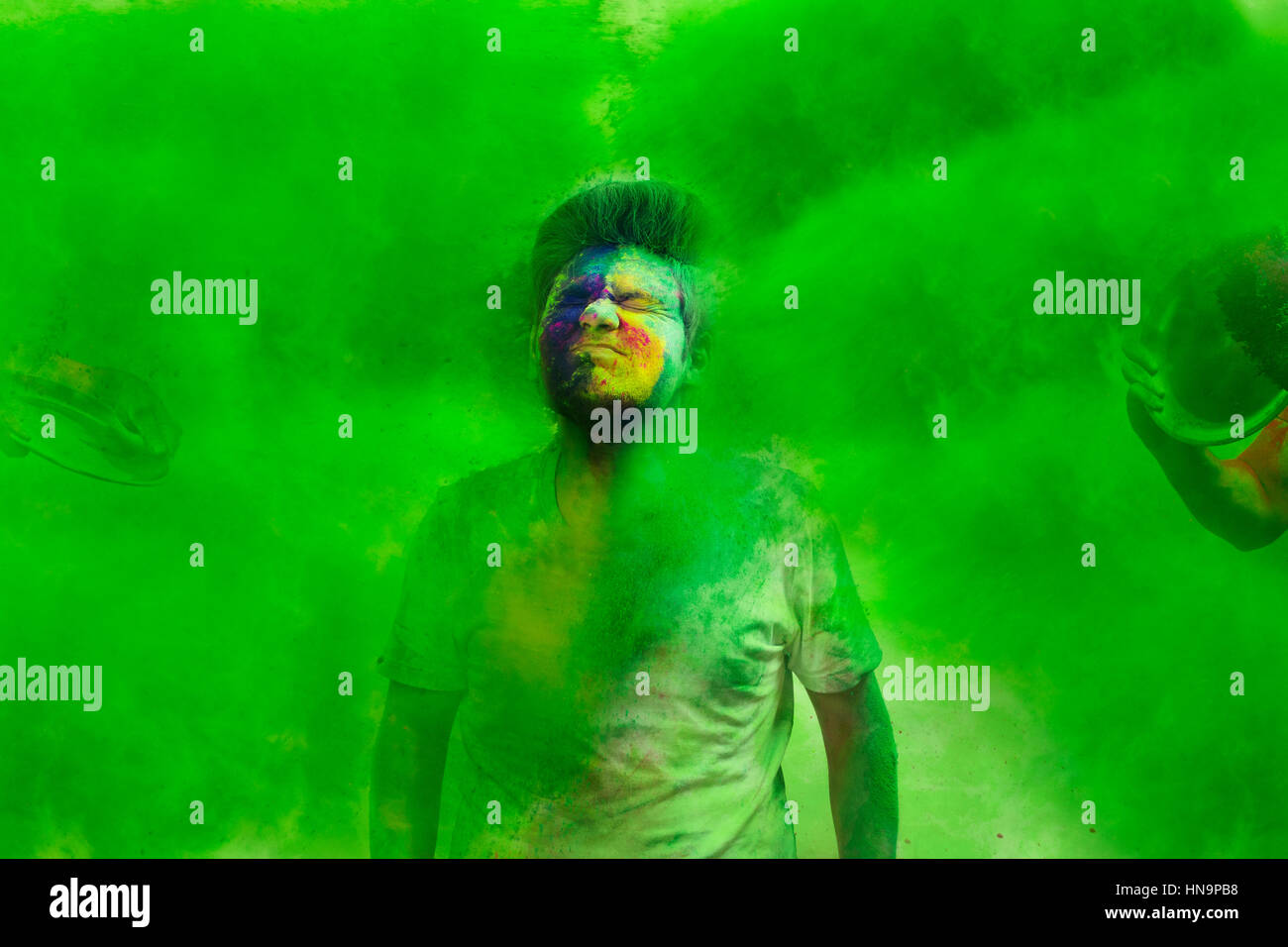 Young man with holi colors Stock Photo - Alamy