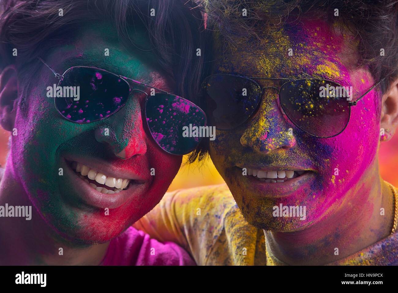 Portrait Of Young Man With Paint On Face During Holi Stock Photo - Alamy