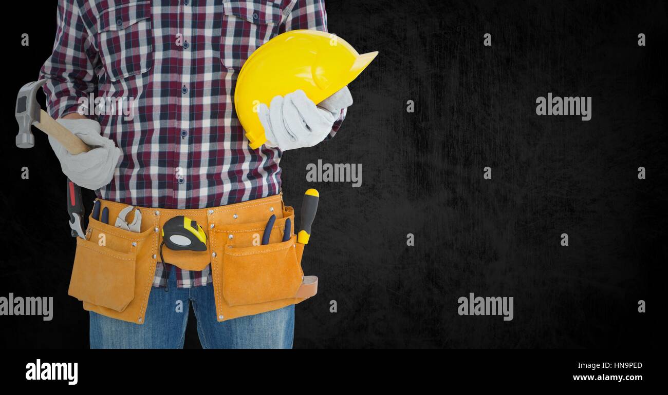 Digital composite of Carpenter with hammer against black background ...