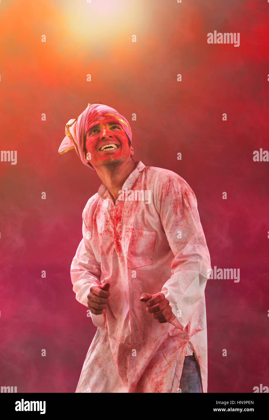 Young Indian man With Colored Face Dancing During Holi Color festival ...