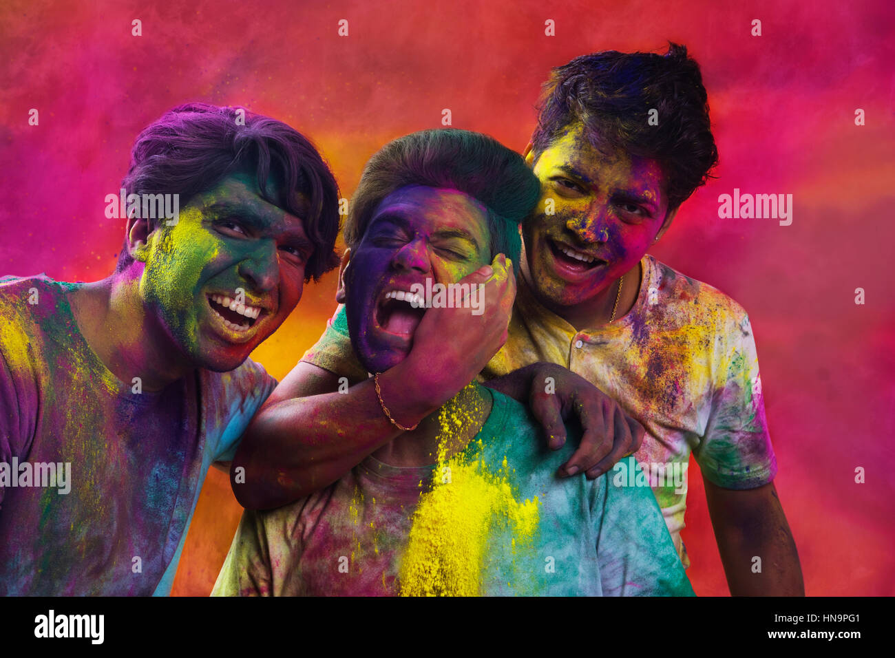 Portrait indian men playing holi hi-res stock photography and images ...