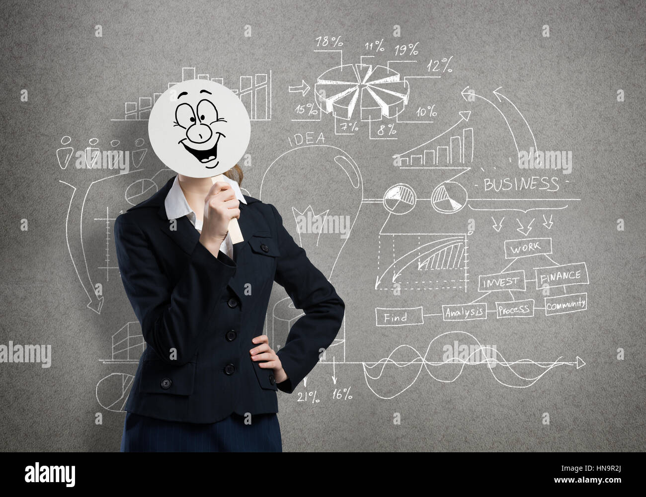 Businesswoman hiding her face behind round mask Stock Photo - Alamy