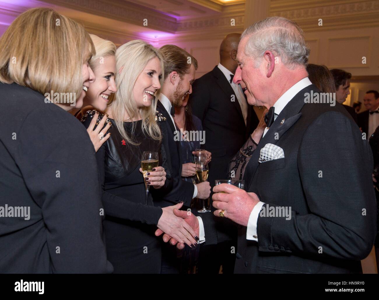 The Prince of Wales speaks to Pixie Lott, her mother Beverley Lott and ...