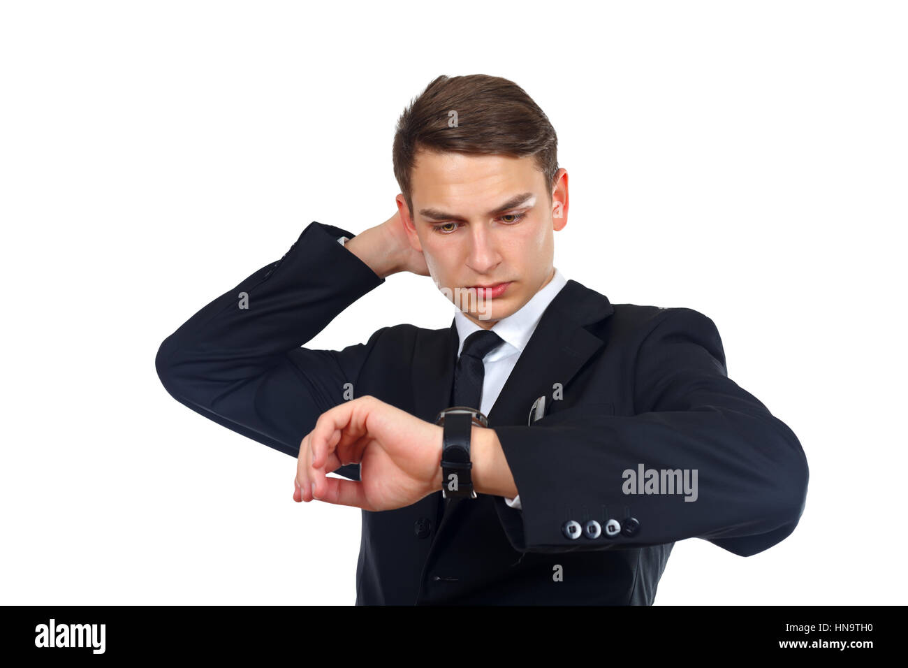 Frustrated businessman checking the time on isolated background Stock ...
