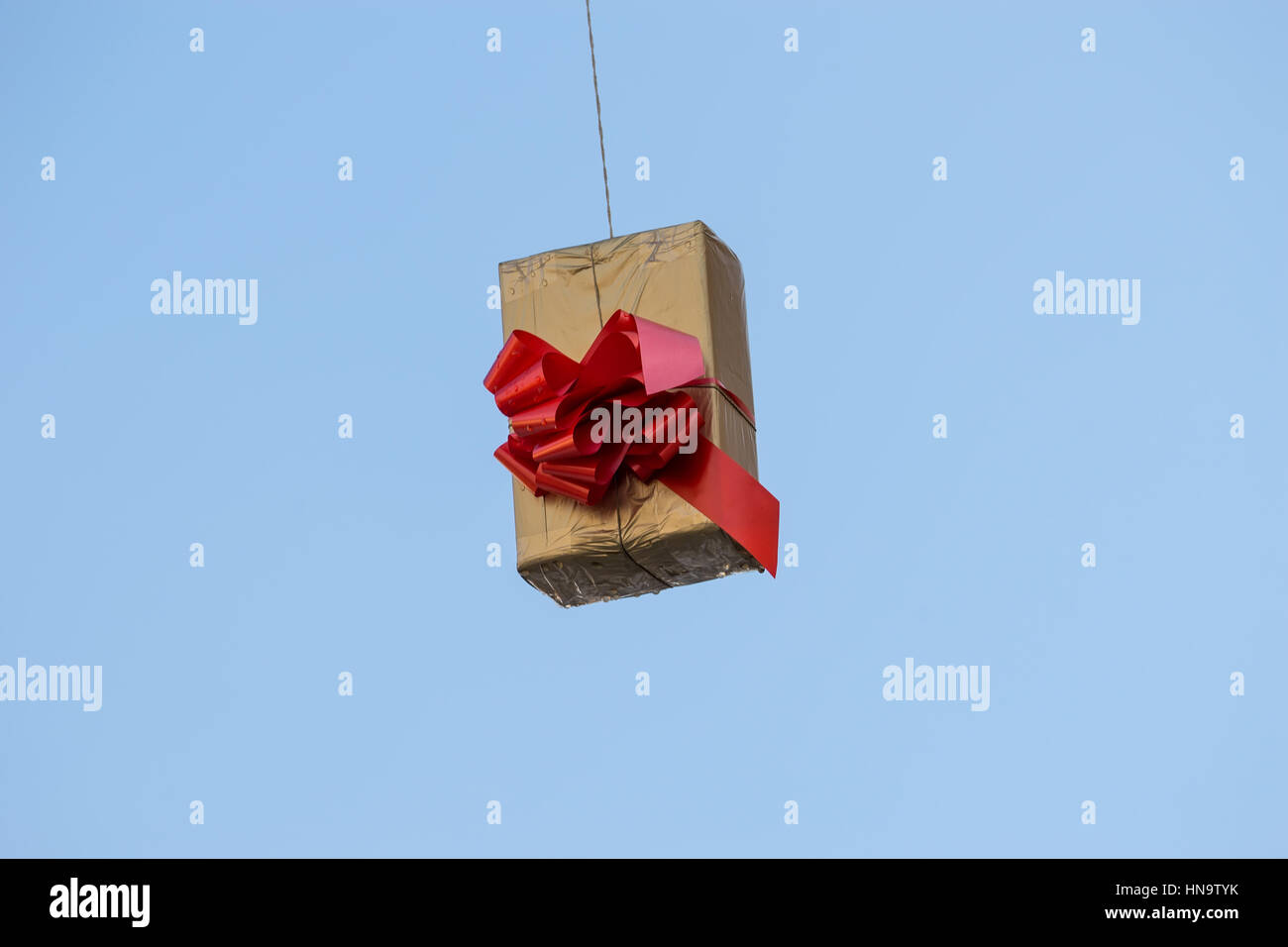 Gift boxes that hang suspended on wires and networks. Street ...