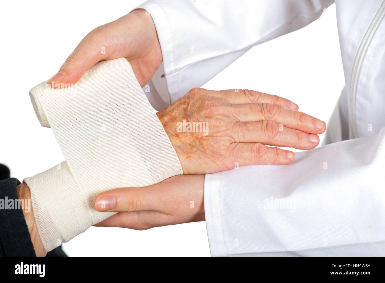 Picture of doctor's hand making a bandage for an elderly hand Stock ...