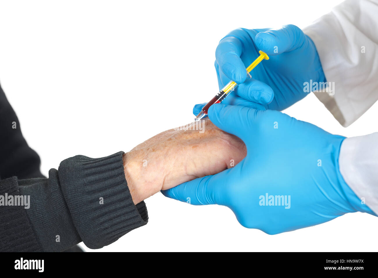 Picture of doctor's hand giving an injection in an elderly hand Stock ...