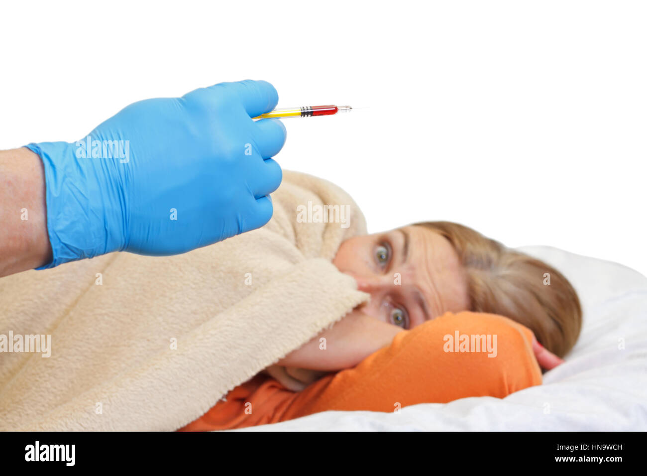 Close up of a scared woman getting an injection Stock Photo - Alamy