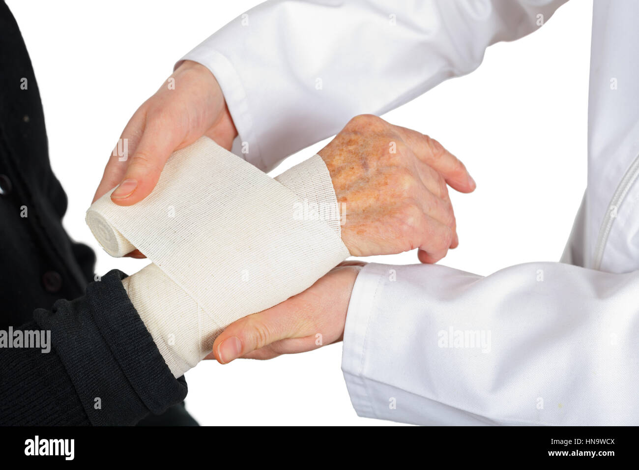 Picture of doctor's hand making a bandage for an elderly hand Stock ...