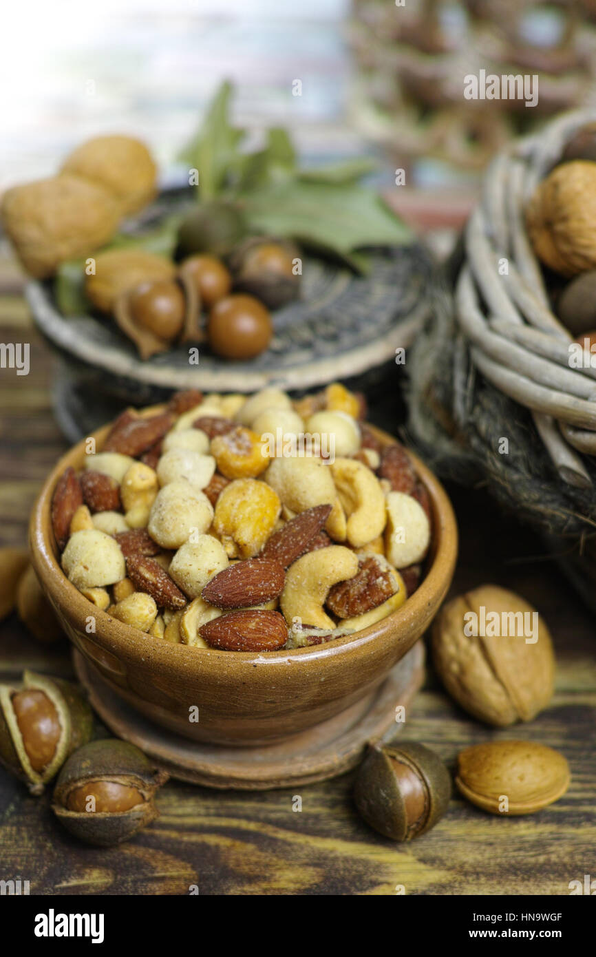 Roasted salted nuts mix, snack from macadamia, walnotes and almonds and ...