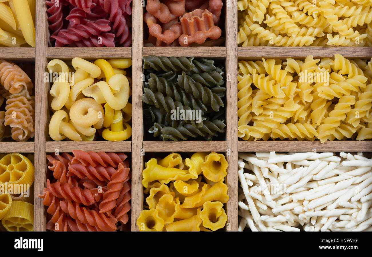 Variety of types, colors and shapes of Italian pasta. Dry pasta ...