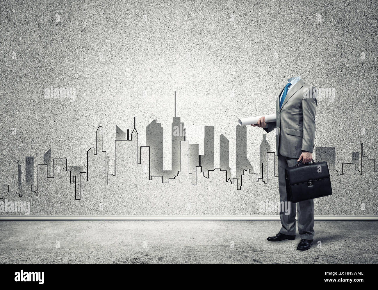 Headless engineer man with papers and case in hand against construction ...