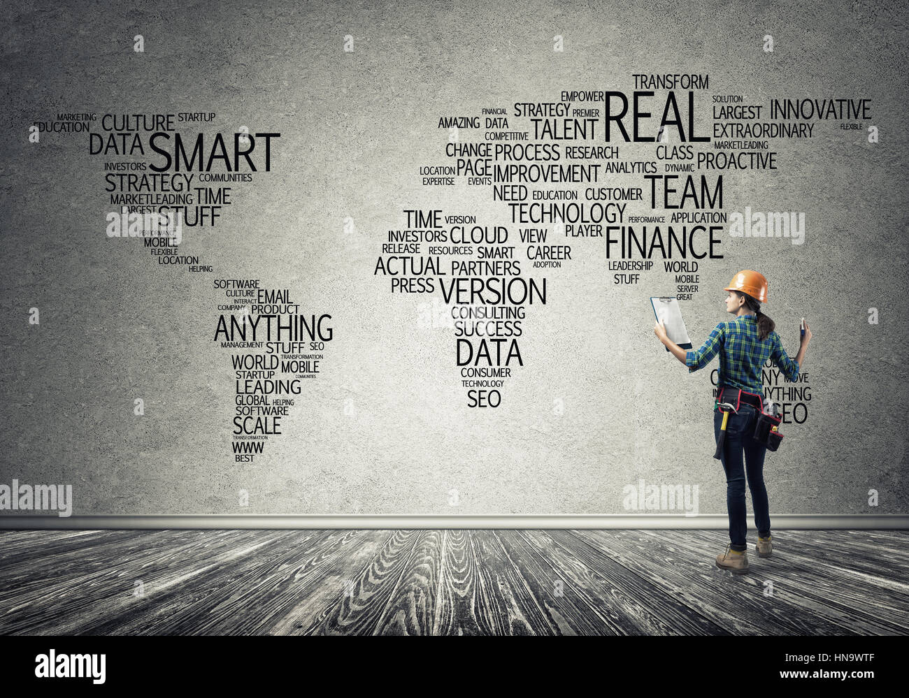 Female construction worker in room and globalization concept Stock ...